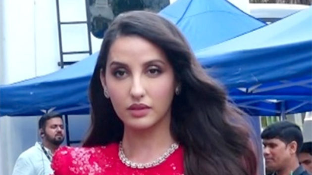 Nora Fatehi flaunts her perfectly curved body in red outfit - Bollywood ...