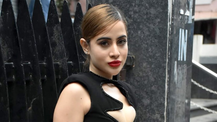 Uorfi Javed poses for paps in a black cut out dress - Bollywood Hungama