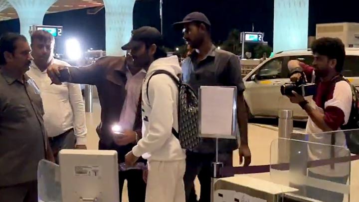 Dhanush poses for a selfie with fans at the airport - Bollywood Hungama