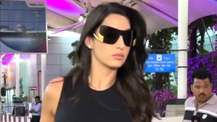 Airport look on point! Nora Fatehi smiles for paps - Bollywood Hungama